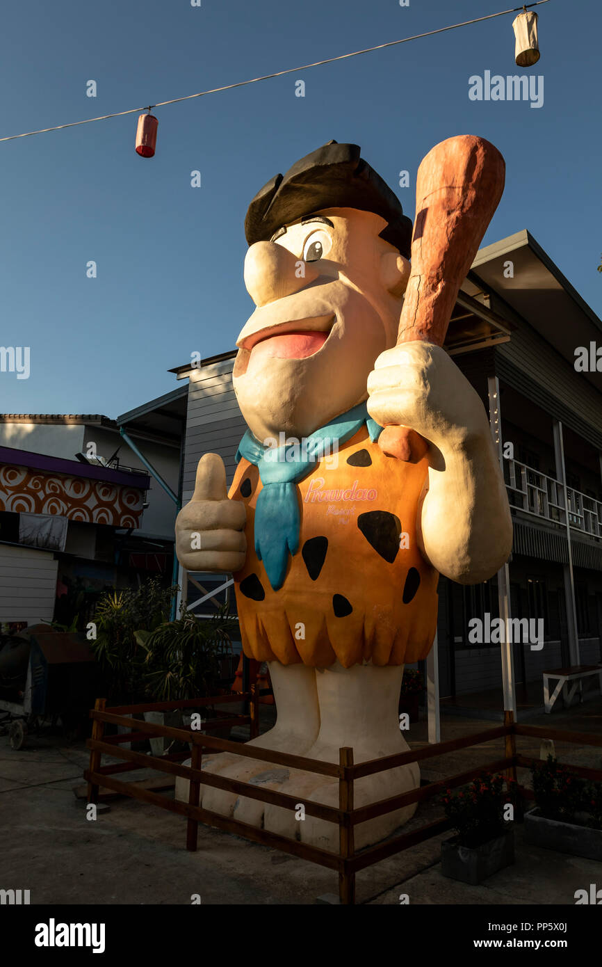 Large Fred Flintstone Statue in Pai, Thailand with a blue sky Stock ...