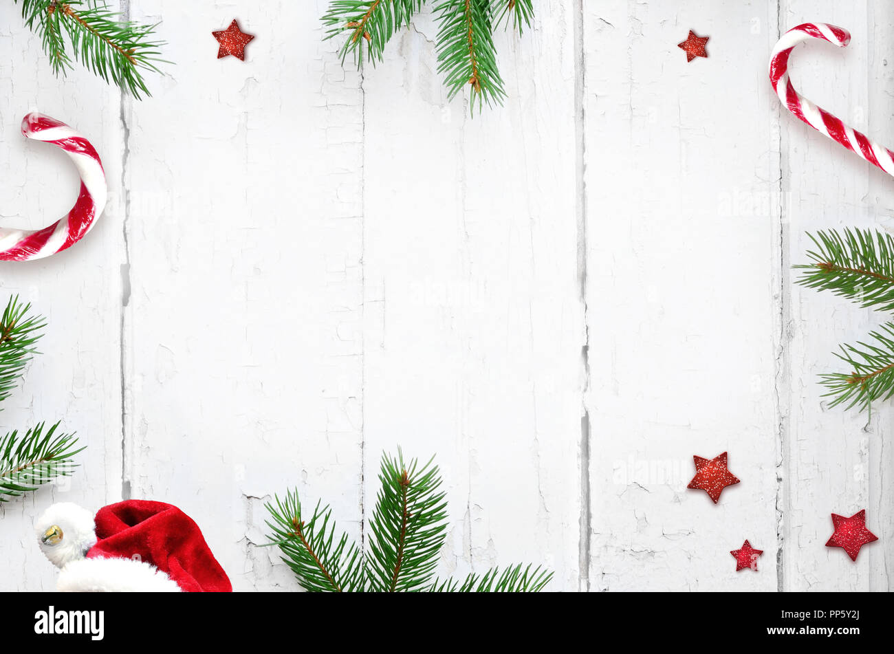 Christmas composition. Christmas gift, candy cane and fir tree branches. Top view, flat lay ...