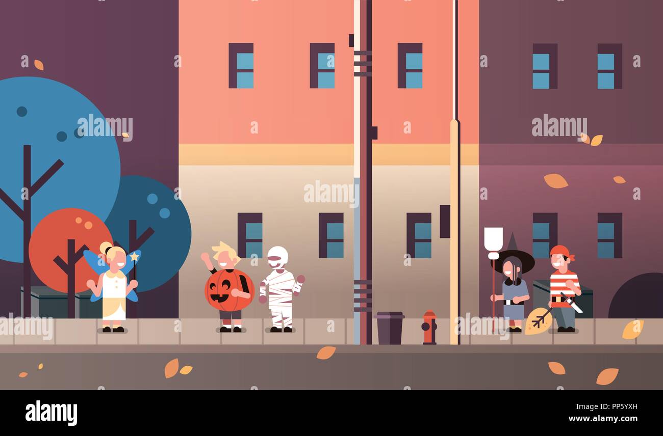 kids wearing monsters fairy pumpkin pirate mummy witch costumes walking ...