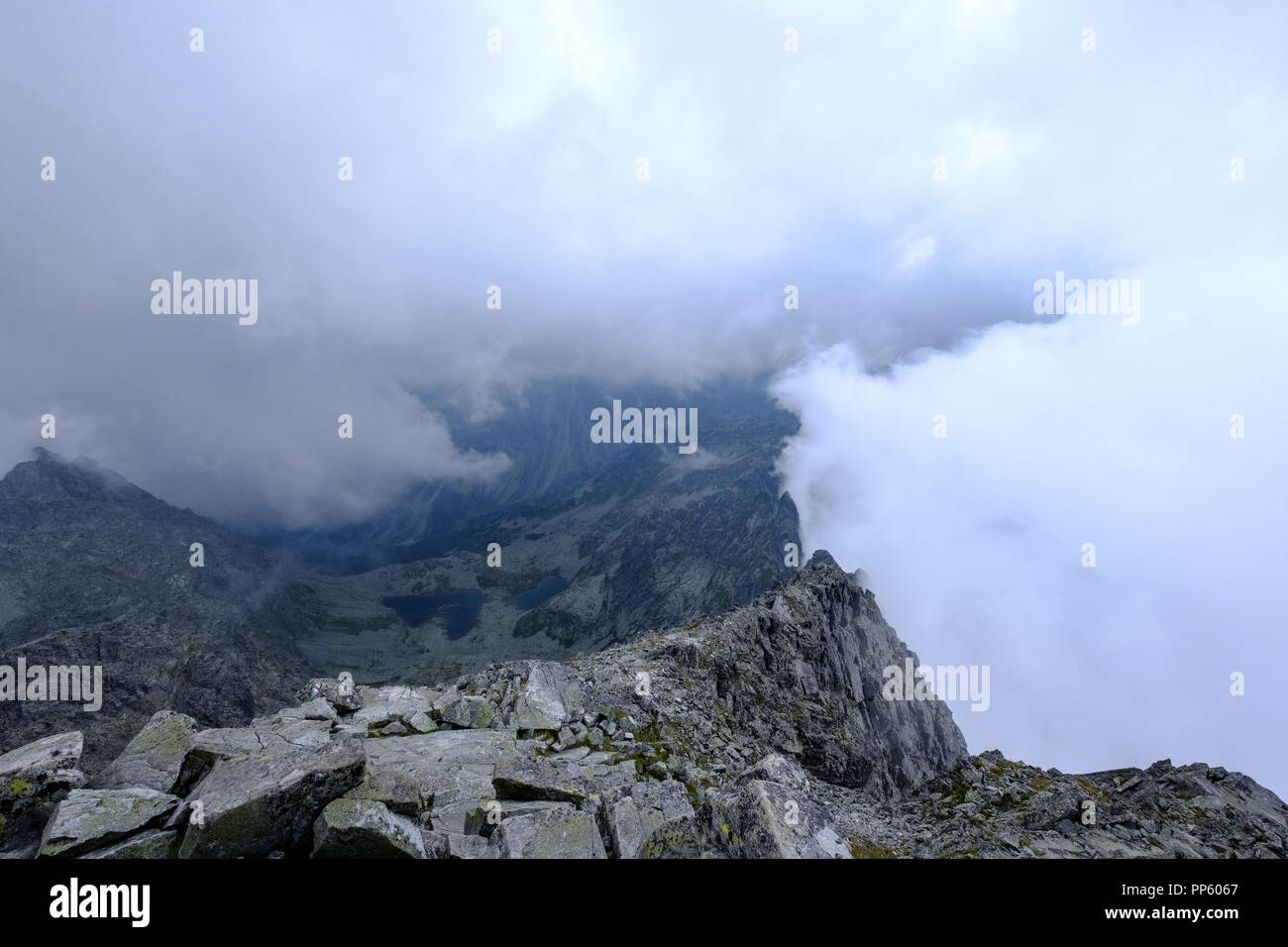rocky sharp mountain tops in Tatra mountains in Slovakia with clouds ...