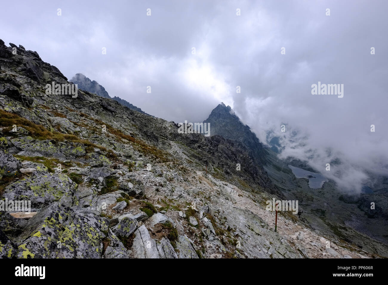 rocky sharp mountain tops in Tatra mountains in Slovakia with clouds ...