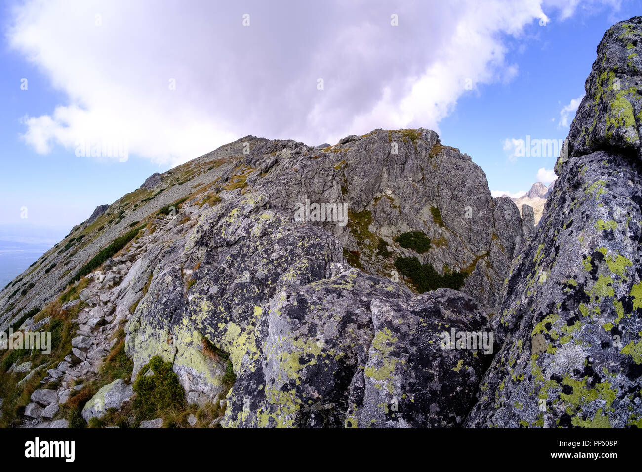 rocky sharp mountain tops in Tatra mountains in Slovakia with clouds ...