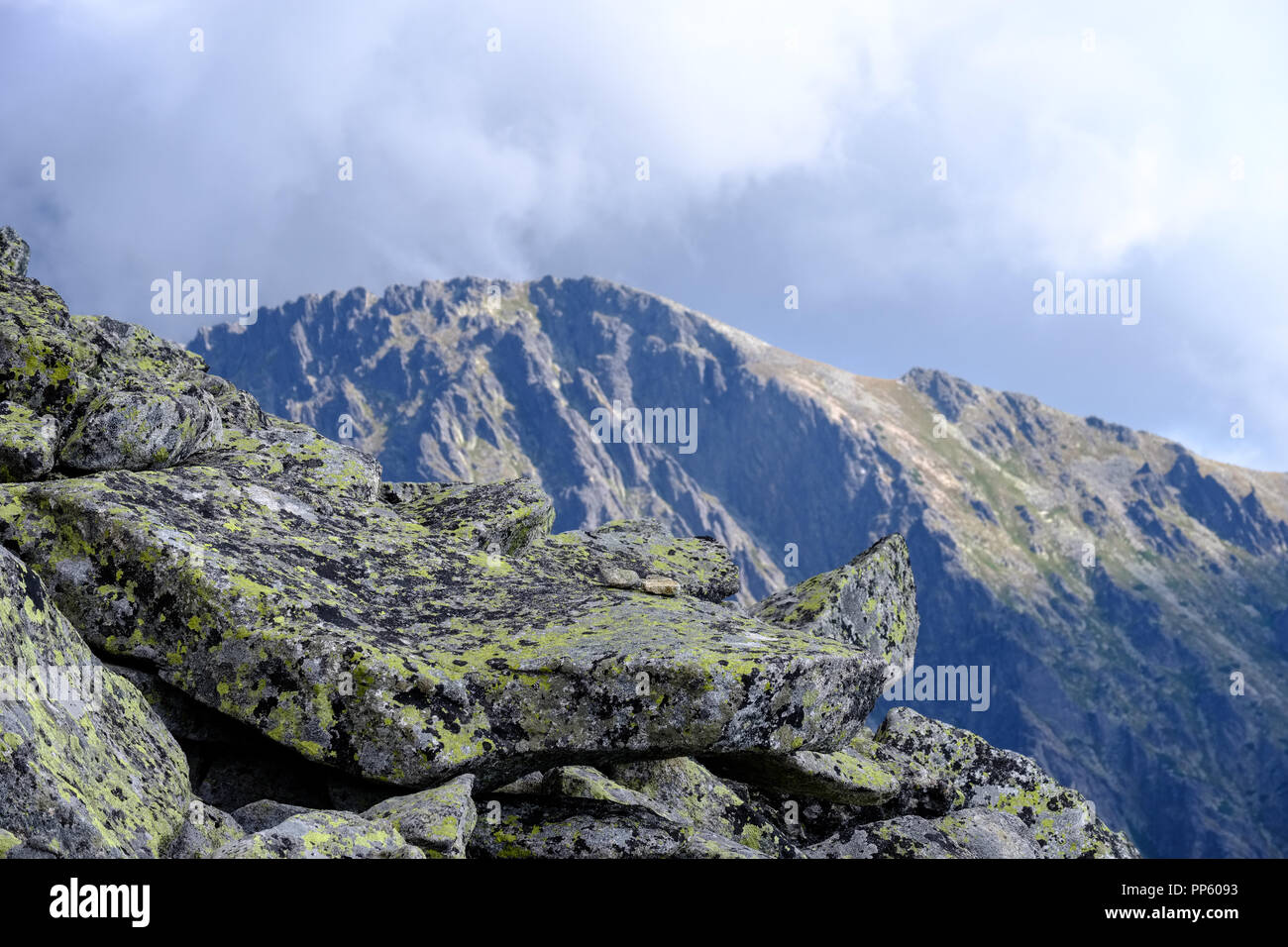rocky sharp mountain tops in Tatra mountains in Slovakia with clouds ...