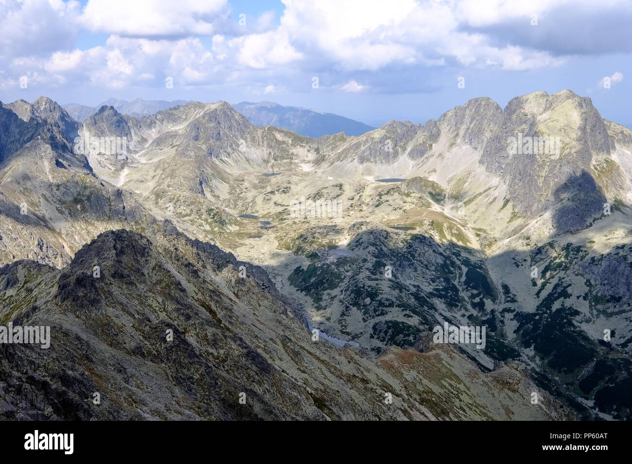 rocky sharp mountain tops in Tatra mountains in Slovakia with clouds ...