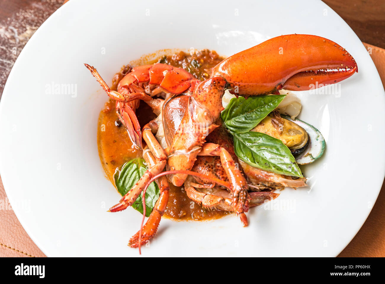 Pastis Grilled Halved Lobster Tails with mussel calamari Stock Photo ...