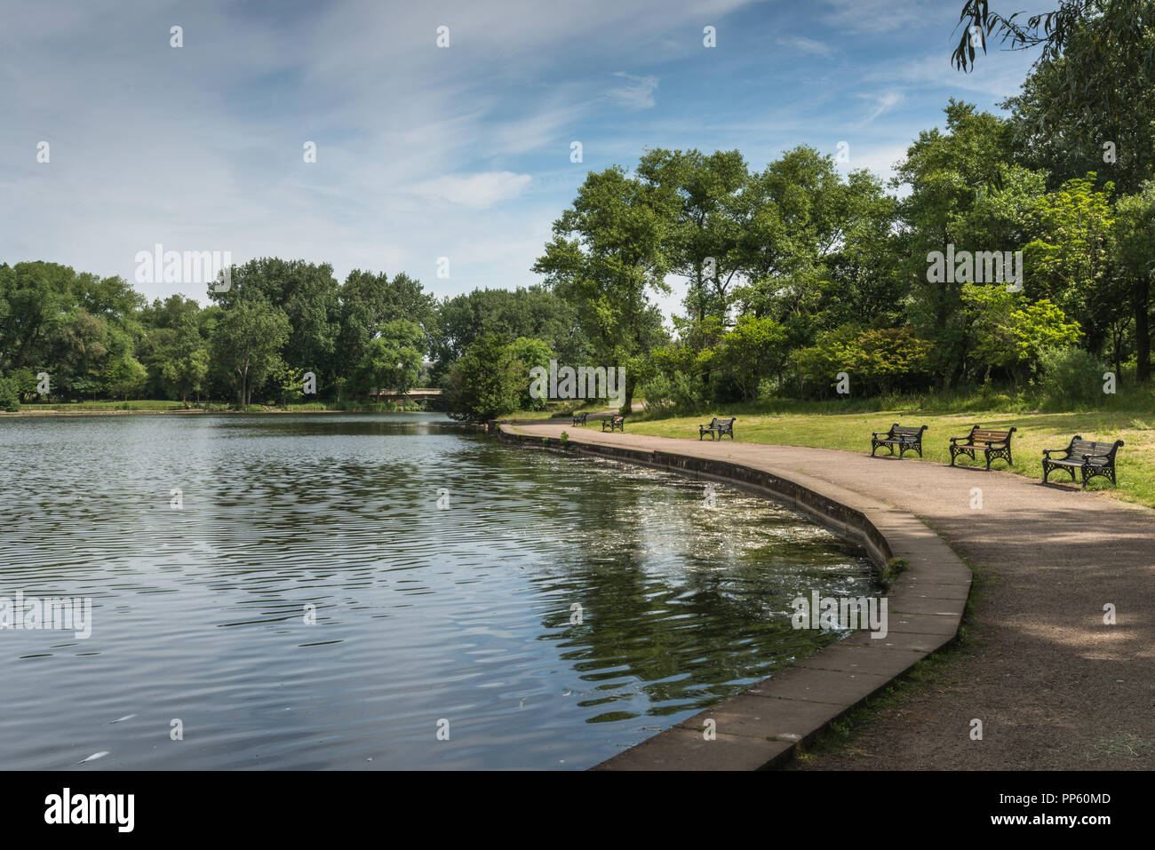 Peaceful lakeside view in the public park of Stanley Park in Blackpool, Lancashire, UK on a ...