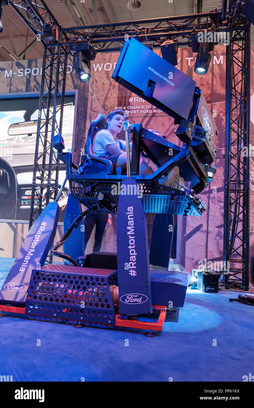 Visitor in the 4D driving simulator of Ford #RaptorMania at the world's ...
