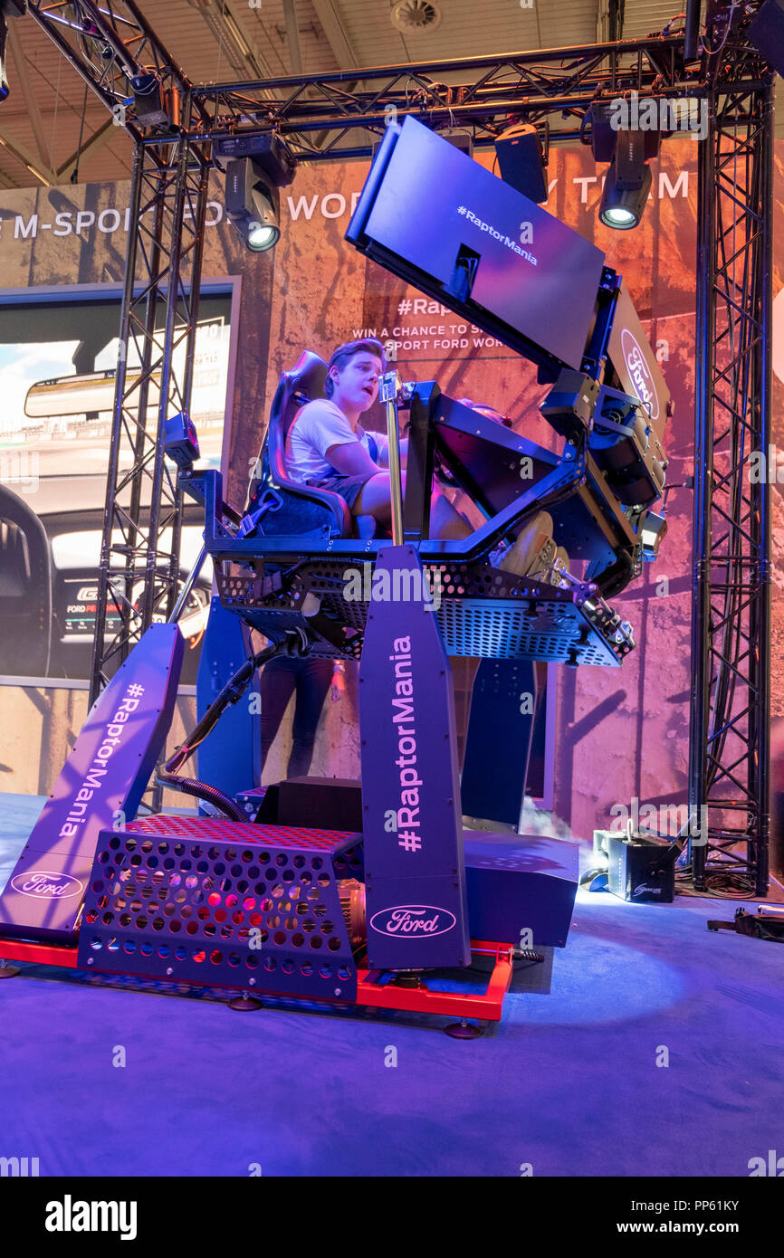 Visitor in the 4D driving simulator of Ford #RaptorMania at the world's ...