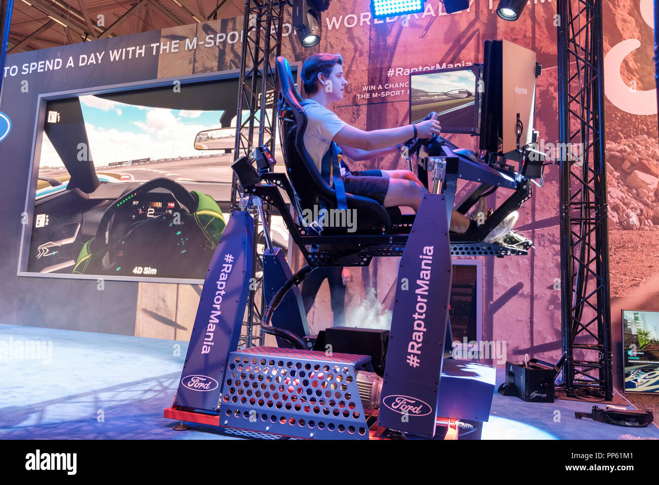 Visitor in the 4D driving simulator of Ford #RaptorMania at the world's ...