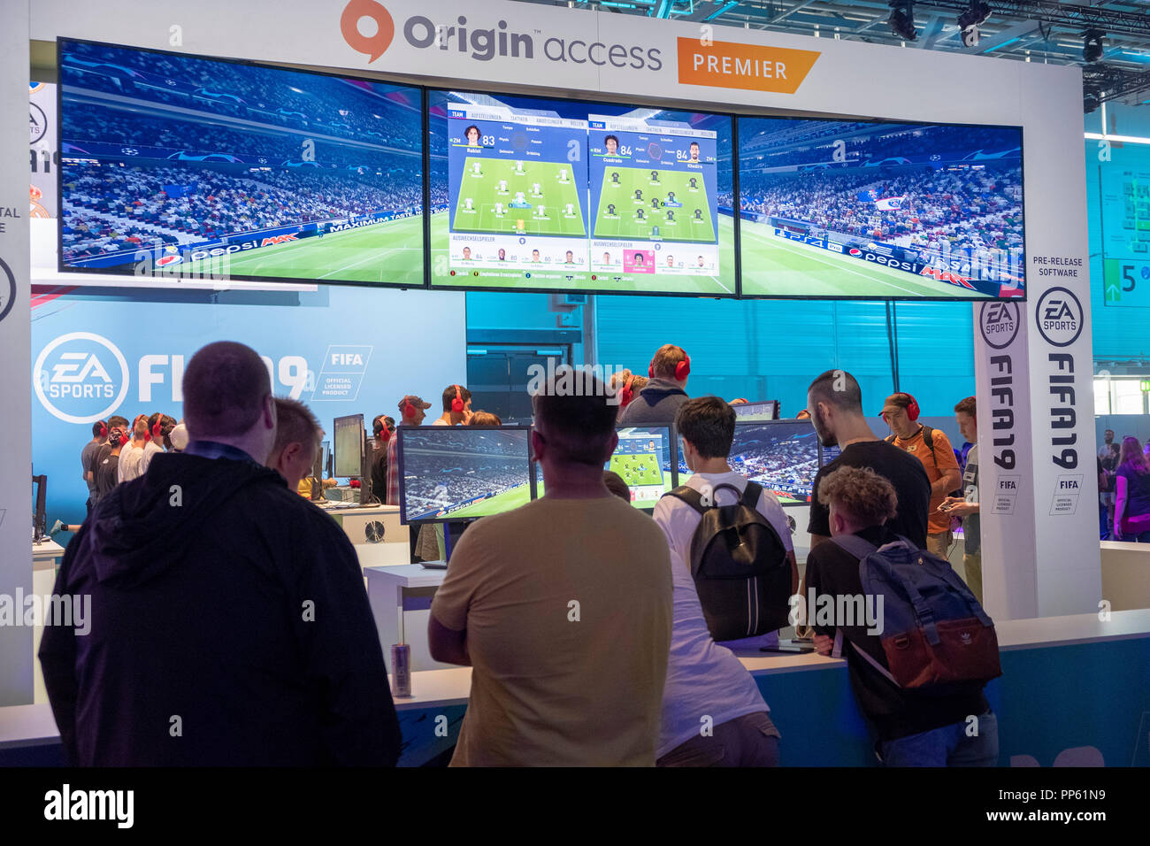 Visitors play the new FIFA19 football video gameat the world's largest ...