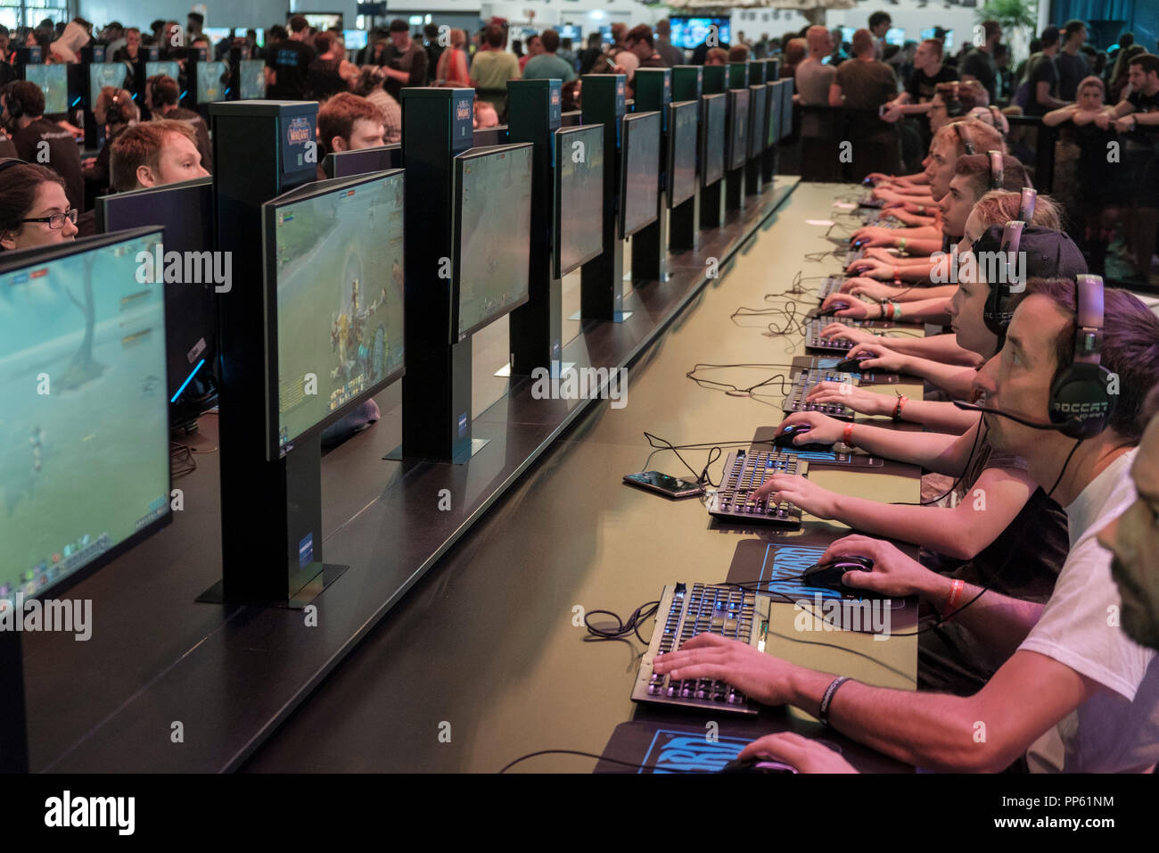 Visitors play the computer game World of Warcraft at the world's ...