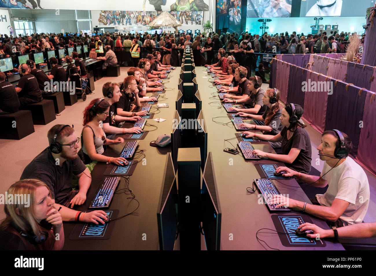 Visitors play the computer game World of Warcraft at the world's ...