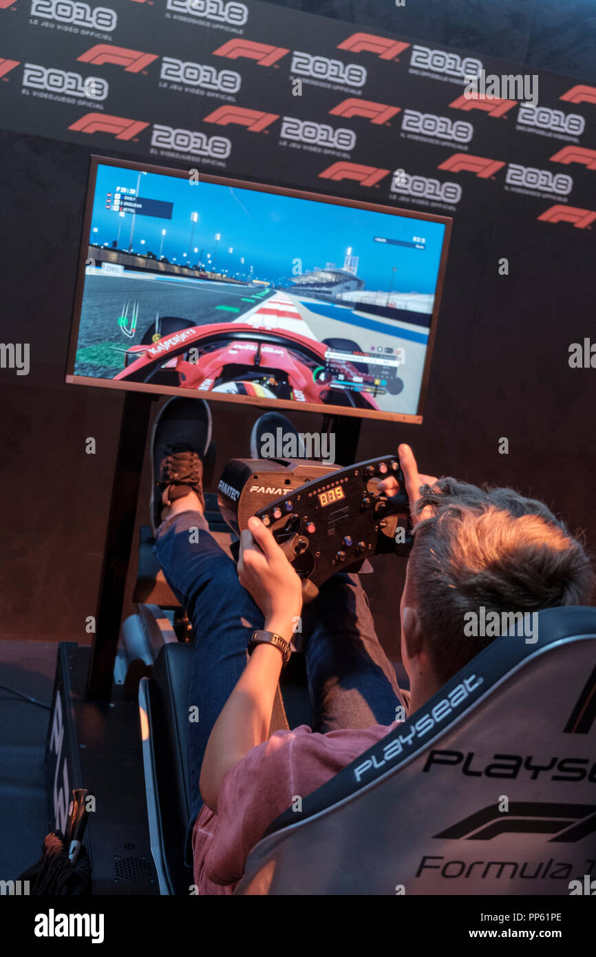 Visitors in the driving simulator F1 2018 at the world's largest fair ...