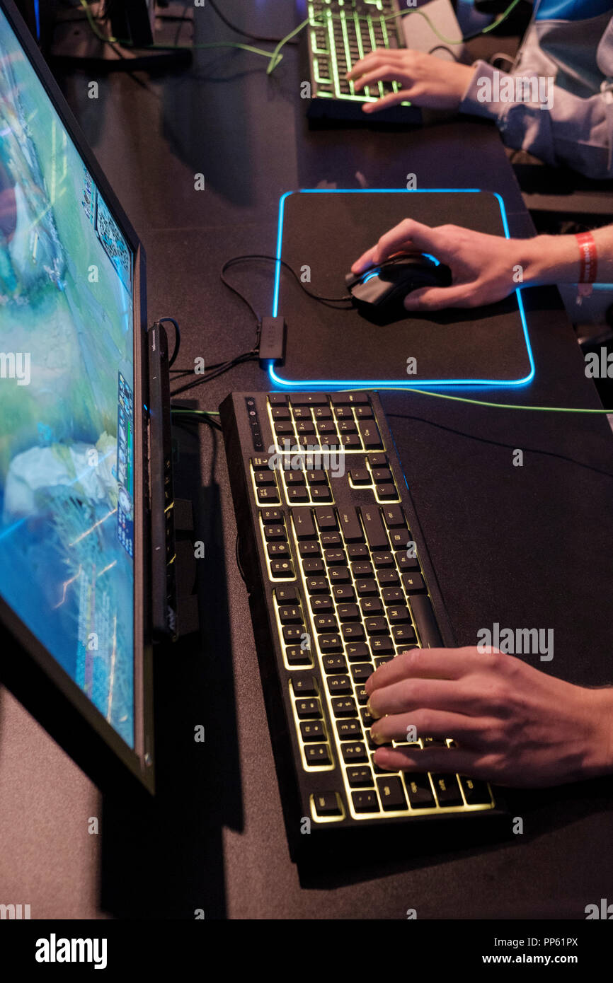 hands on gaming mouse and illuminated keyboard at the world's largest ...