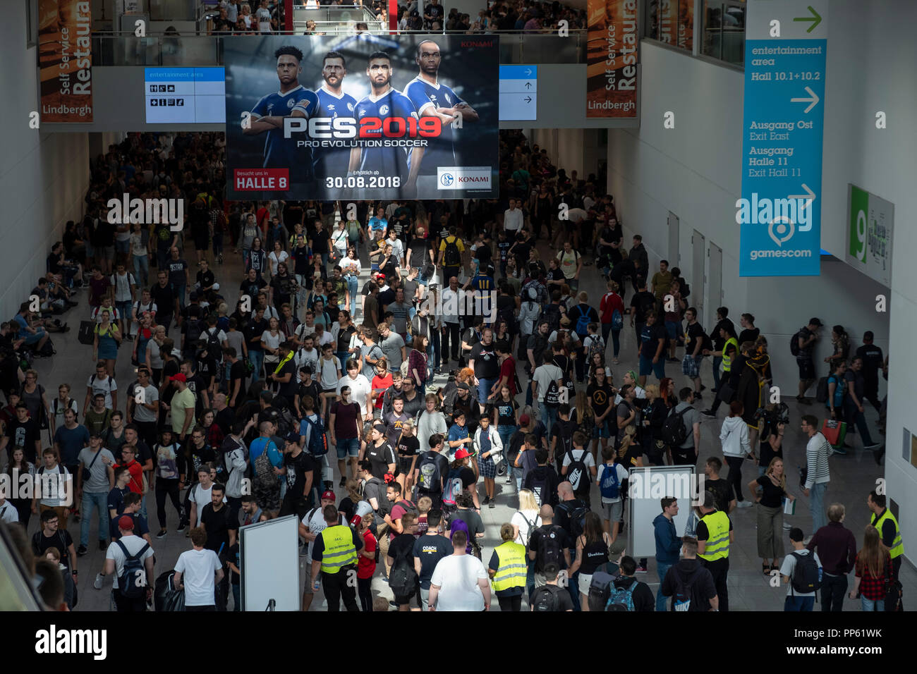 Crowd of visitors under the logo for PES 2019, Pro Evolution Soccer ...