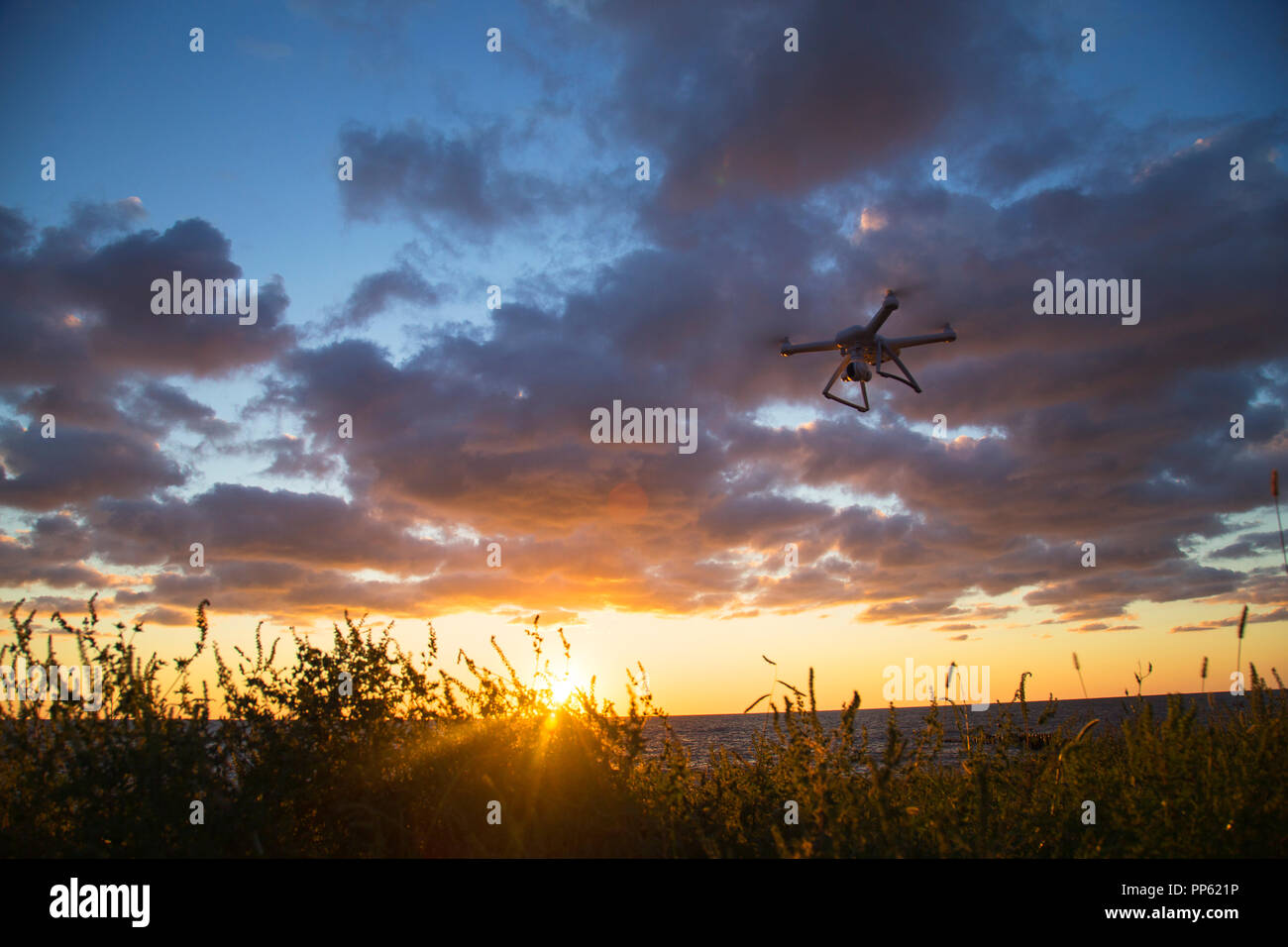 Drone on sunset Stock Photo - Alamy