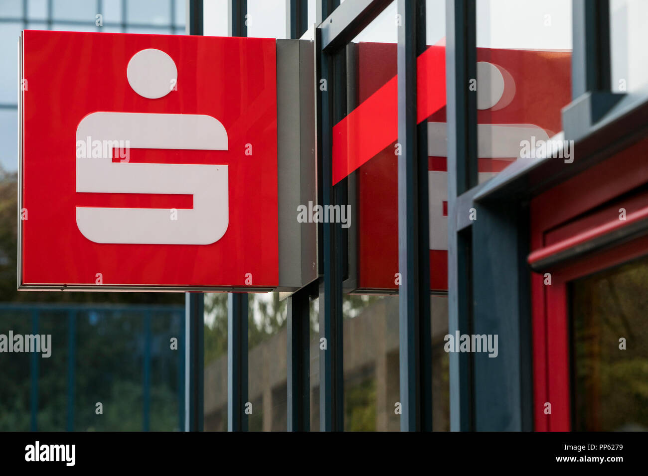 A logo sign outside of the headquarters of Stadtsparkasse München in ...