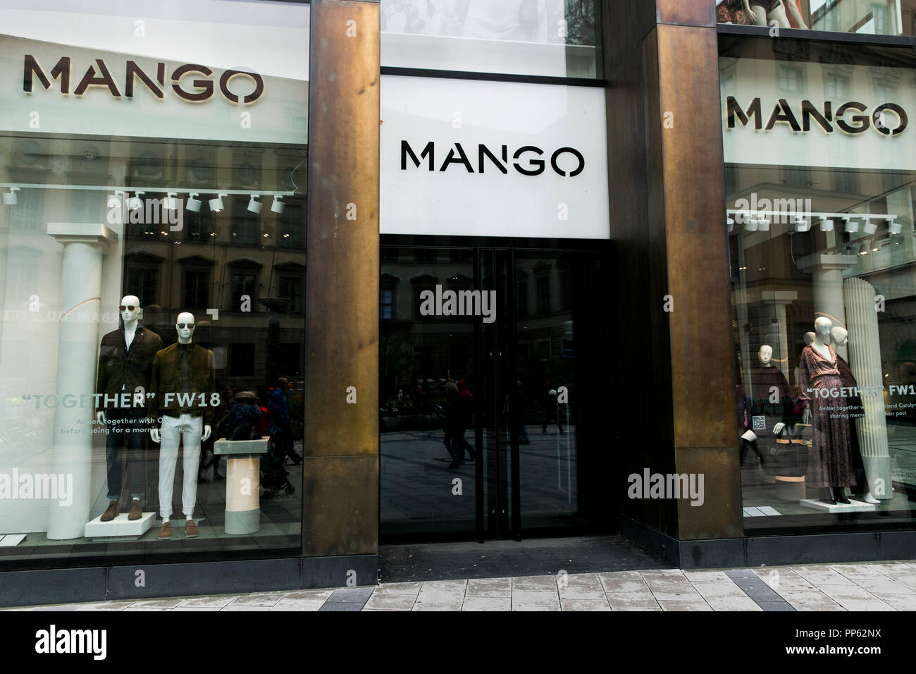 A logo sign outside of a MANGO retail store in Munich, Germany, on ...