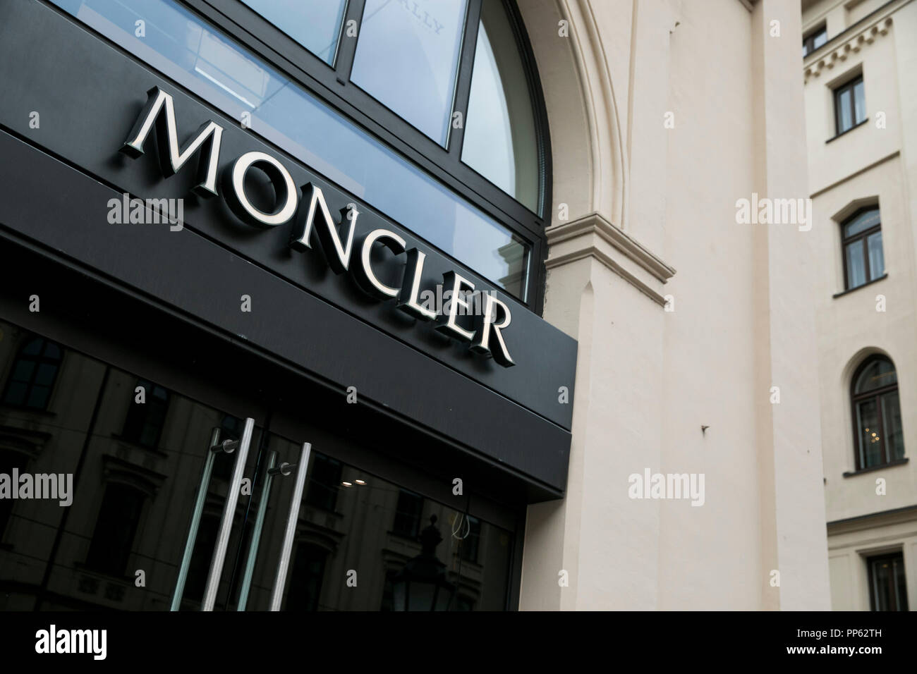 A logo sign outside of a Moncler retail store in Munich, Germany, on ...
