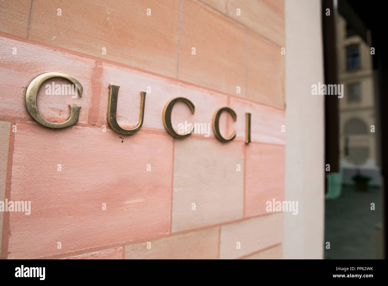 A logo sign outside of a Gucci retail store in Munich, Germany, on ...