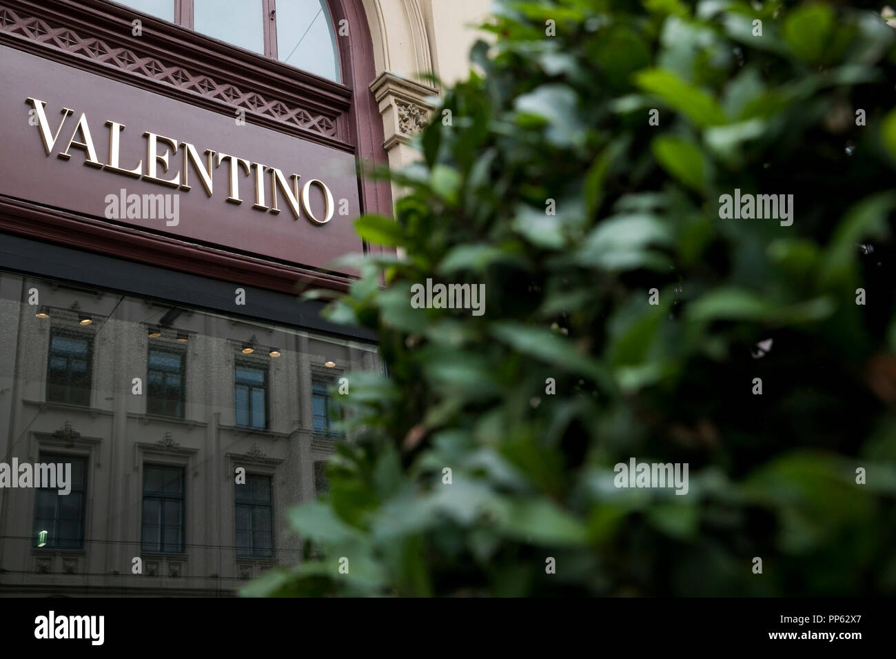 A logo sign outside of a Valentino retail store in Munich, Germany, on ...