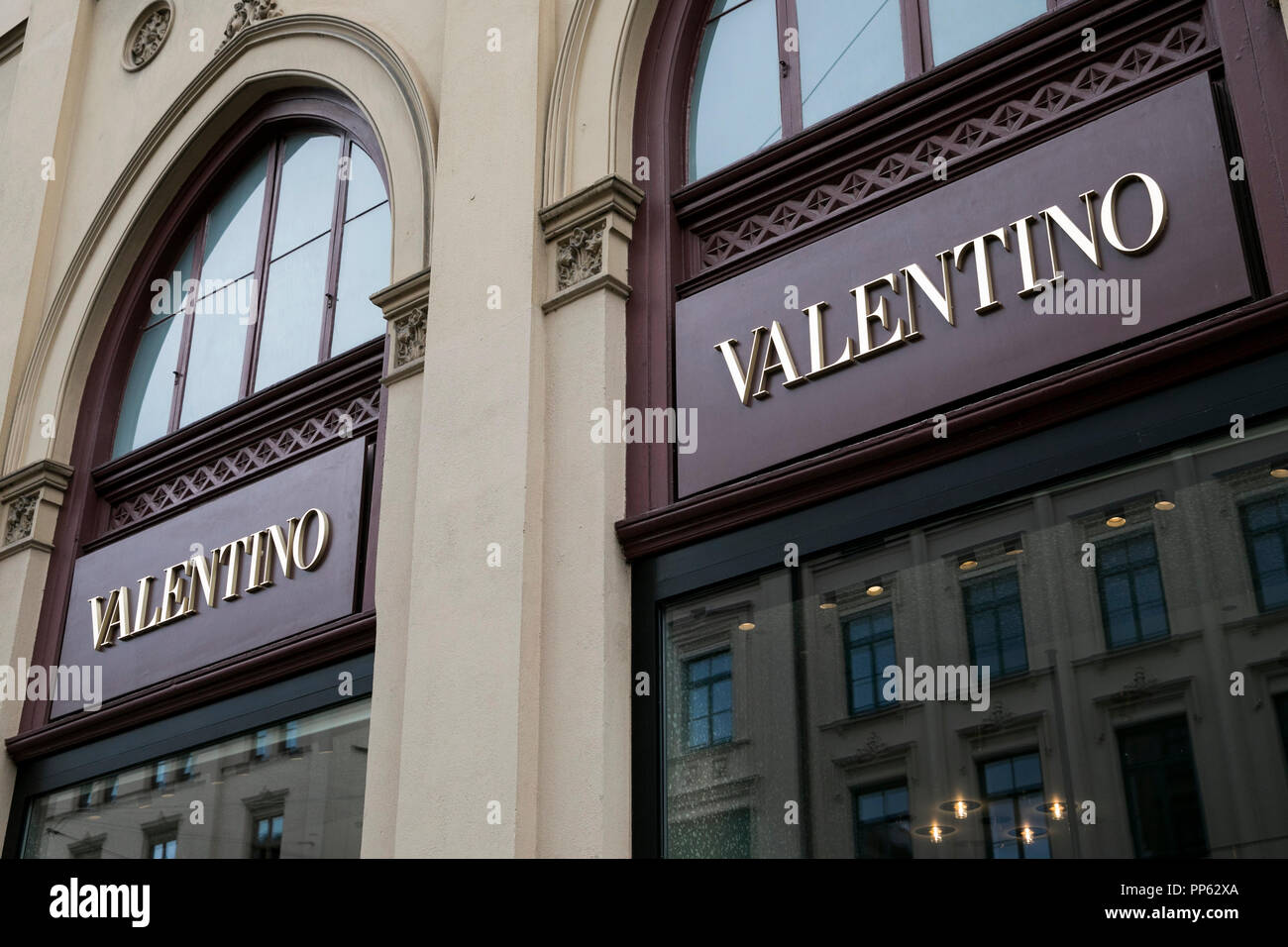 A logo sign outside of a Valentino retail store in Munich, Germany, on ...