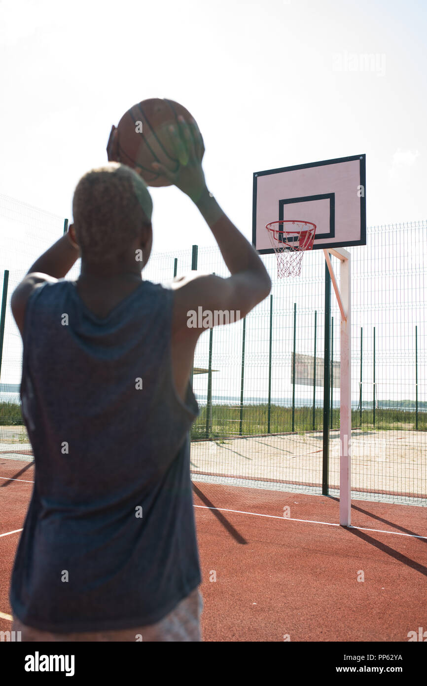 African Man Throwing Ball Stock Photo - Alamy