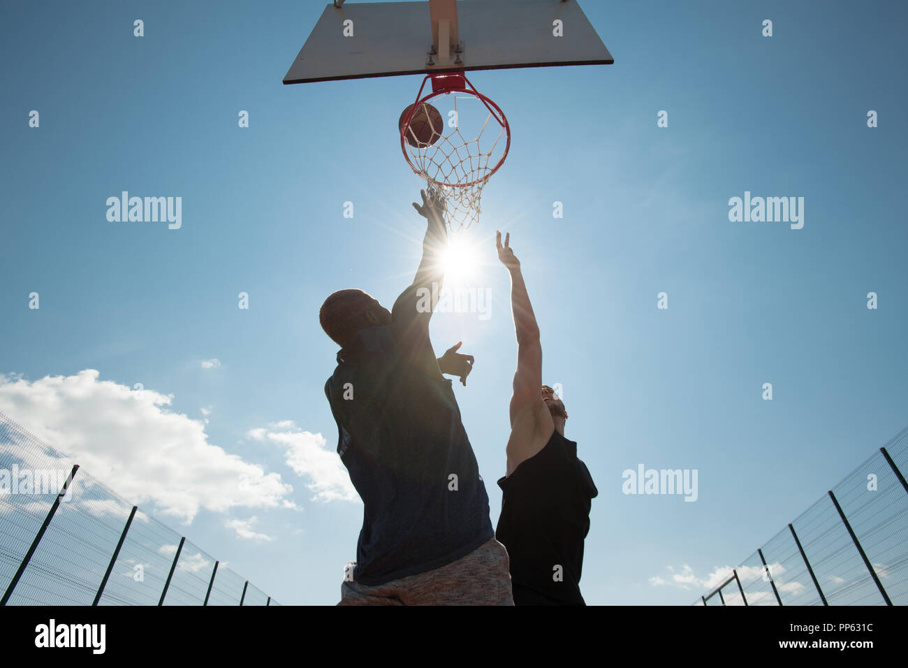 Basketball in Sunlight Stock Photo - Alamy