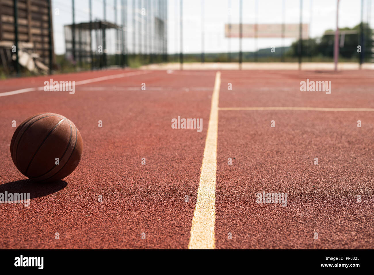 Ball in Basketball Court Stock Photo - Alamy