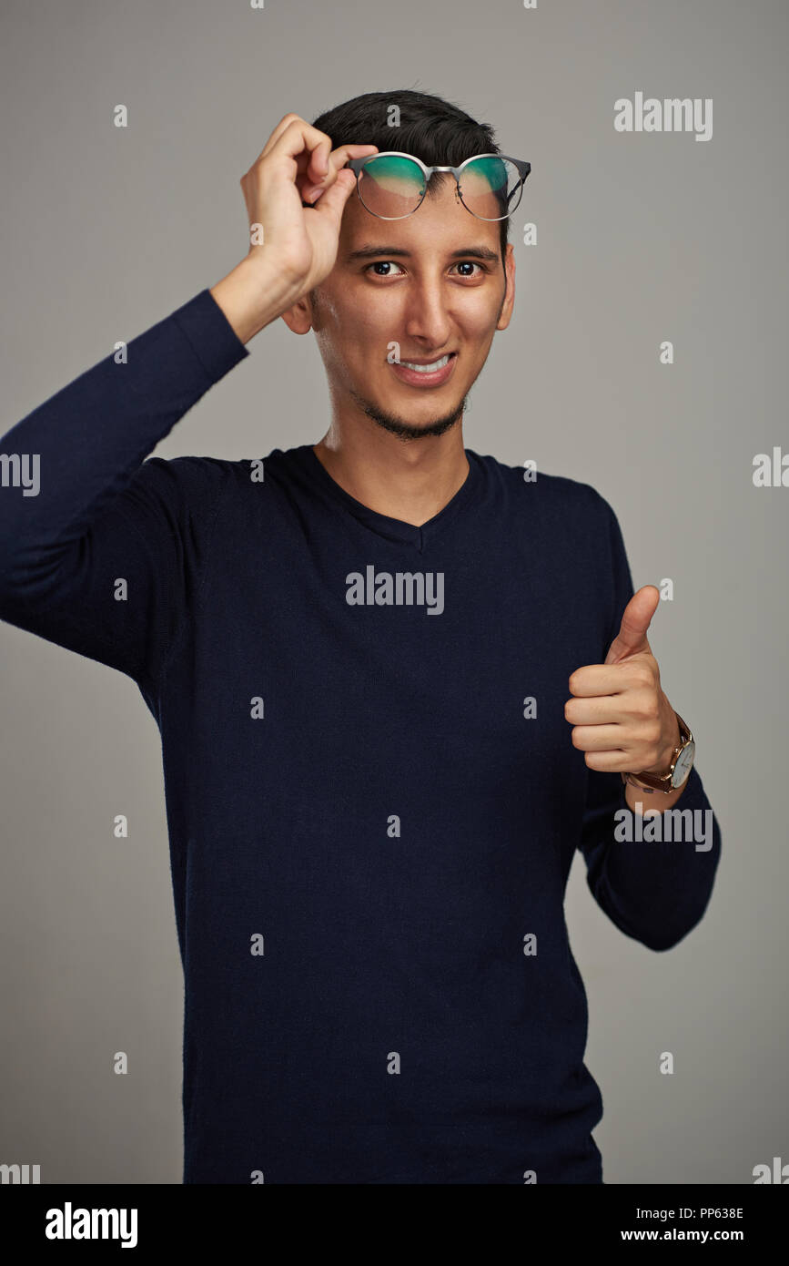 Portrait man taking off glasses hi-res stock photography and images - Alamy