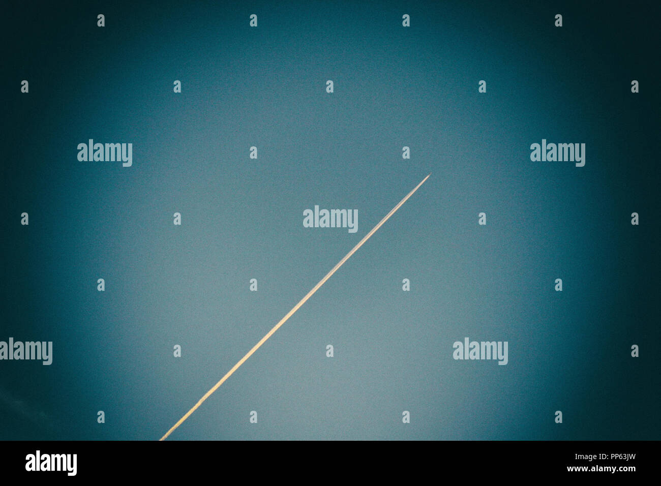 Wallpaper background of an airplane trace in the blue sky. Vignette ...