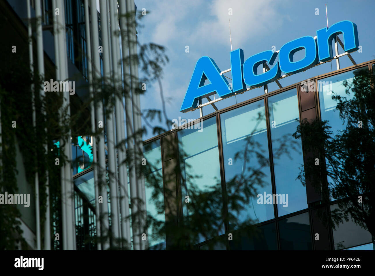 A logo sign outside of a facility occupied by Alcon in Vienna, Austria ...