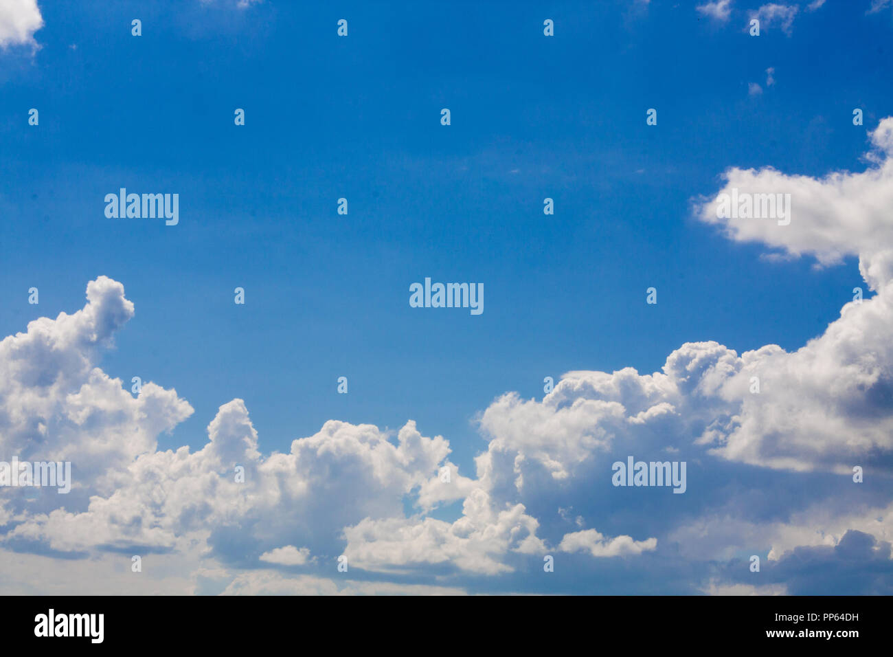 Blue sky background with clouds in bright sunny summer day Stock Photo ...