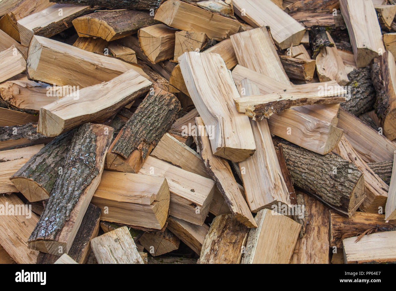 Woodpile of chopped lumber. Pile of wood logs. Stacked firewood timber ...