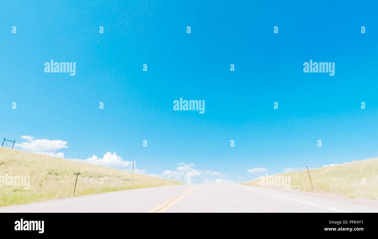 Driving on dirt road through open space in rural suburbia in Colorado ...