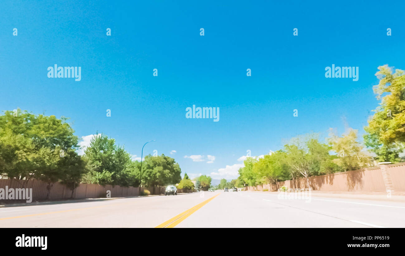 Driving on local road through suburbia in South Denver, Colorado Stock ...