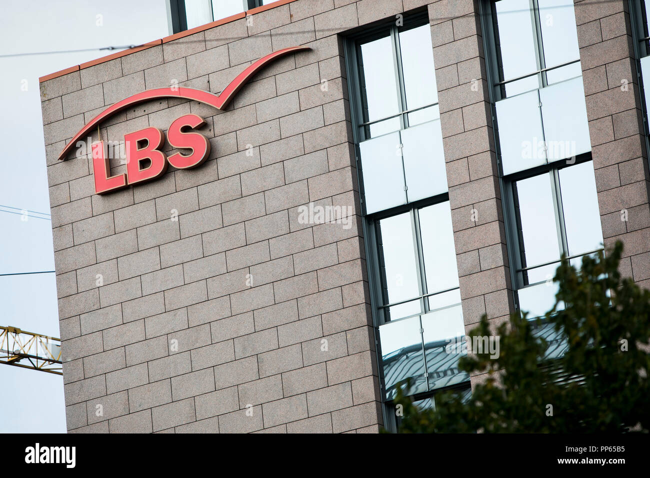 A logo sign outside of the headquarters of LBS Bayerische ...