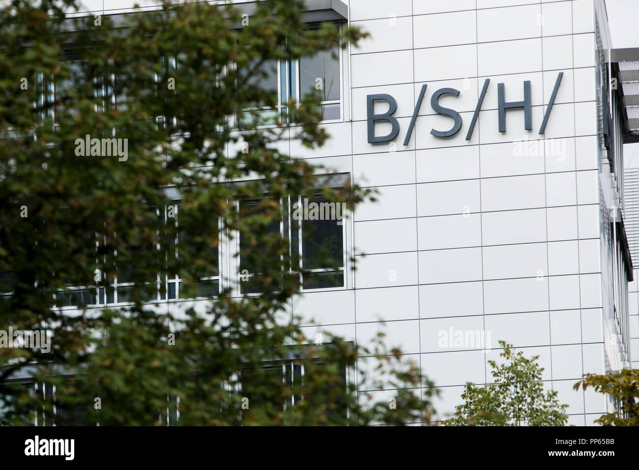 A logo sign outside of the headquarters of BSH Hausgeräte GmbH (BSH ...