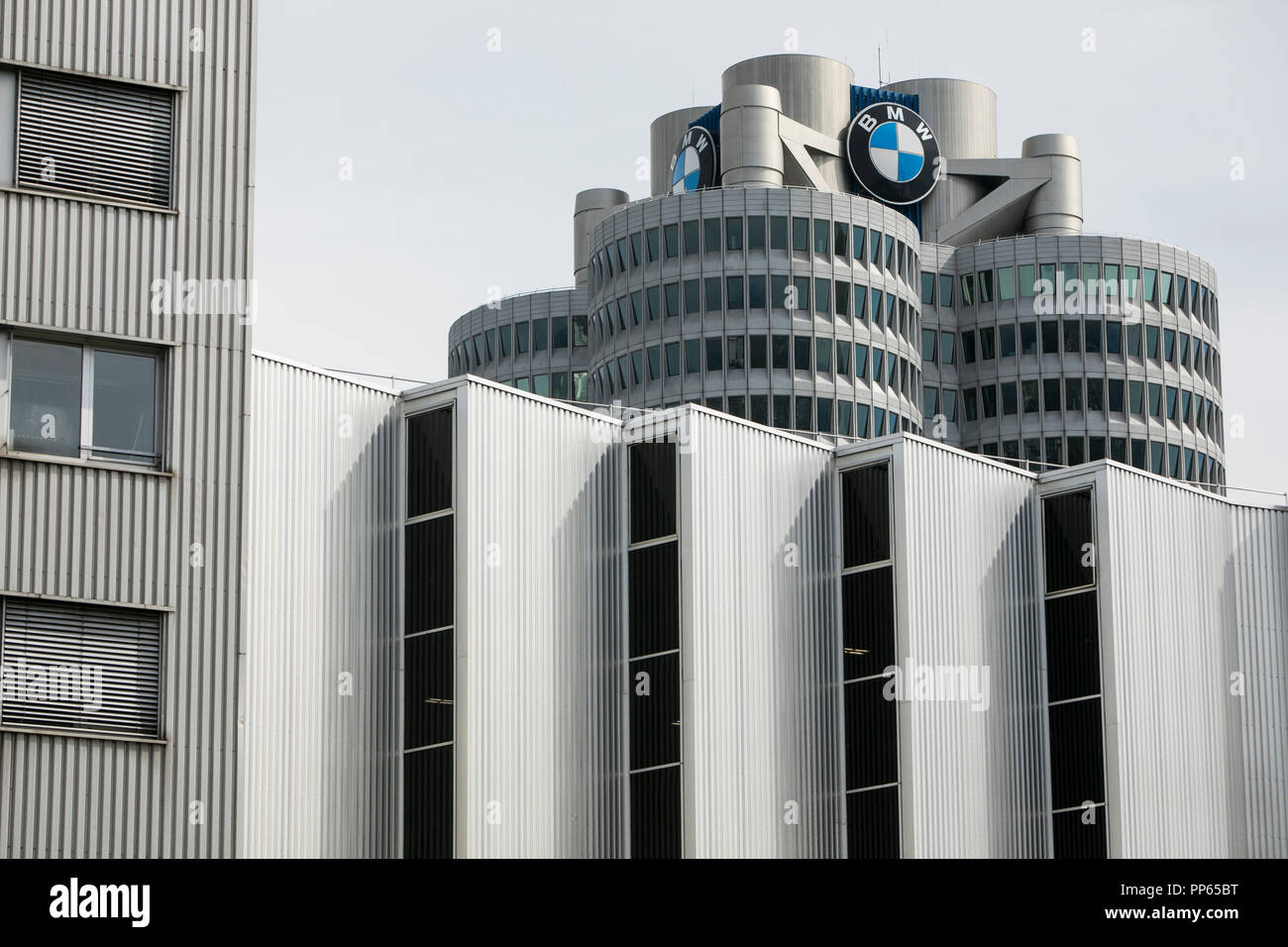 A logo sign outside of the headquarters of the BMW Group (Bayerische ...