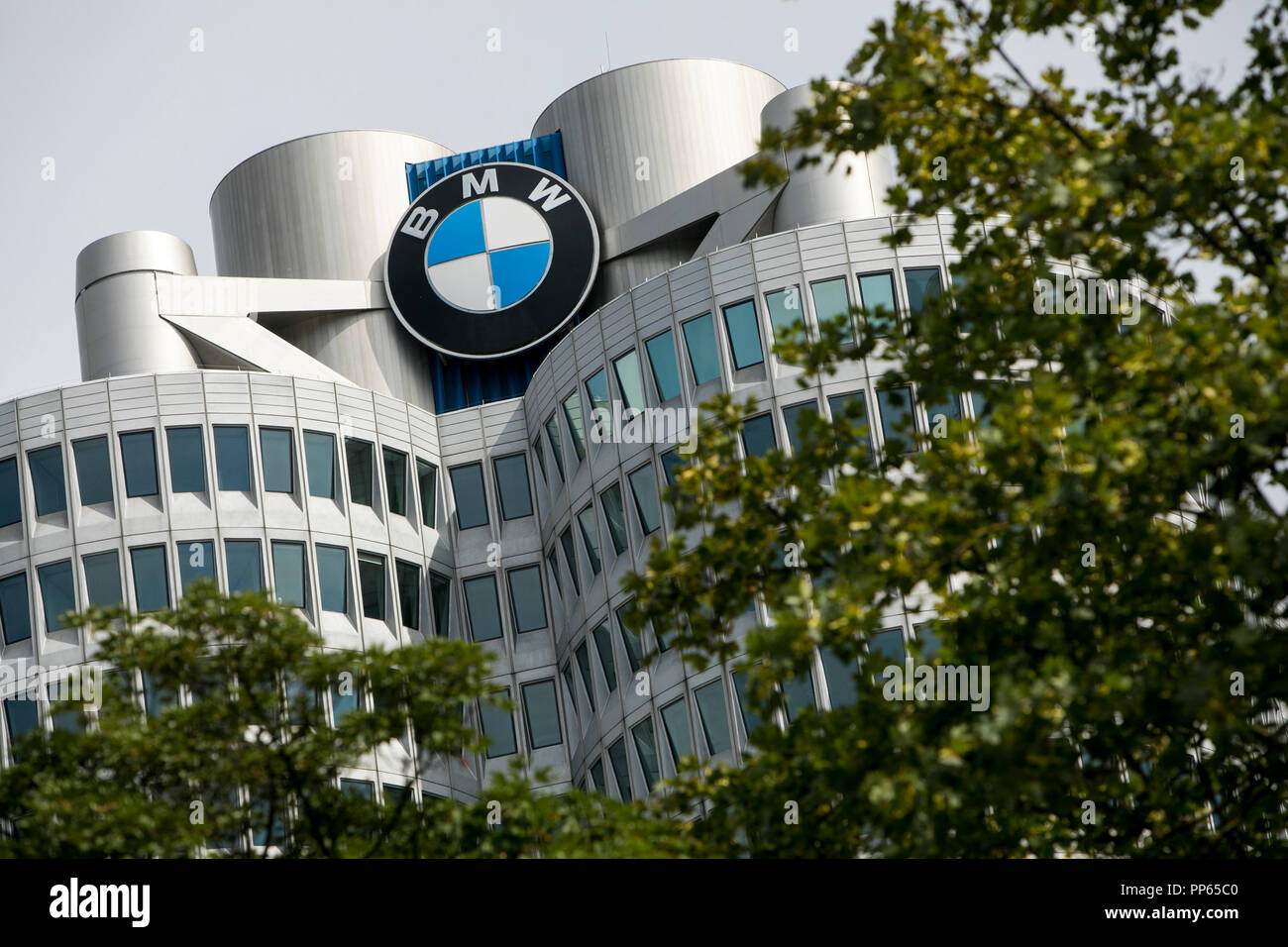 A logo sign outside of the headquarters of the BMW Group (Bayerische ...