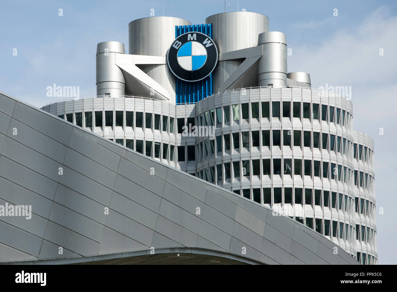 A logo sign outside of the headquarters of the BMW Group (Bayerische ...