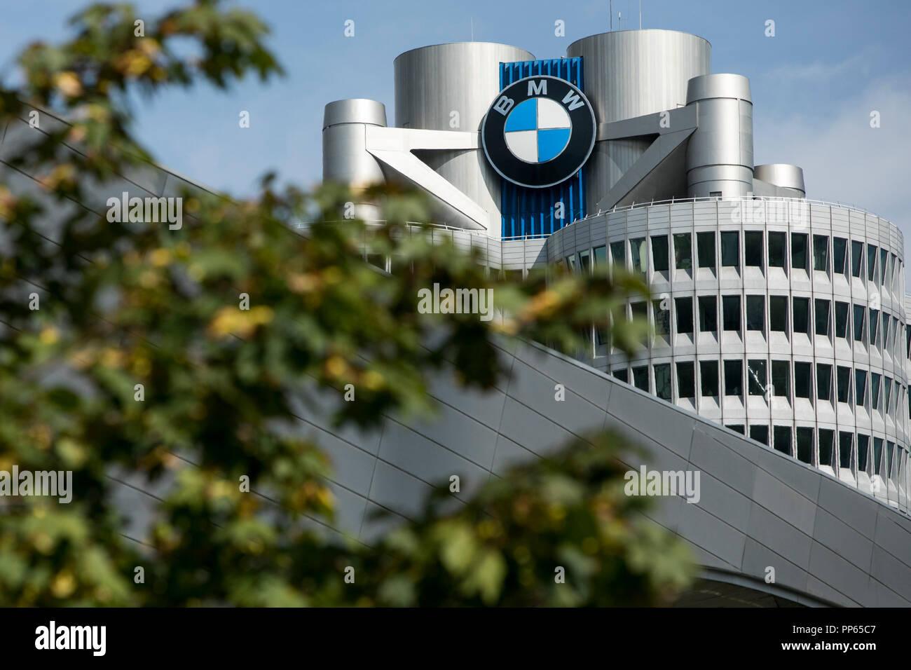 A logo sign outside of the headquarters of the BMW Group (Bayerische ...