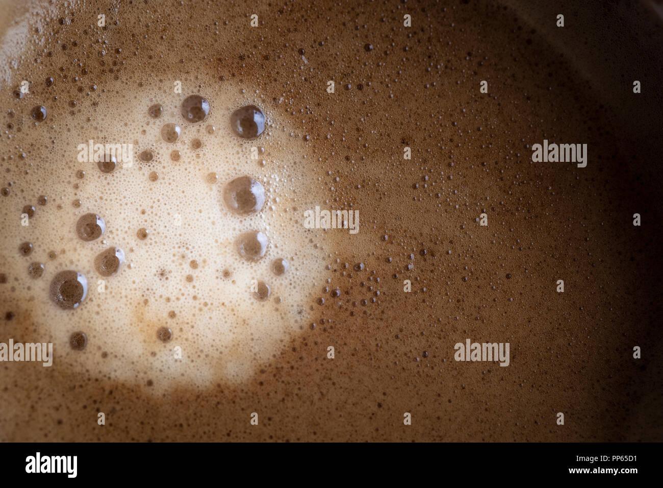 Coffee foam texture close up in cup on top view Stock Photo - Alamy