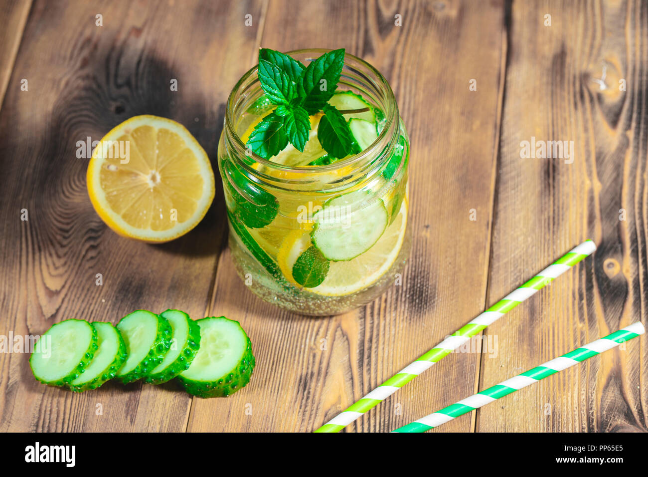 Glass of fresh cucumber water with lemon on table Stock Photo - Alamy