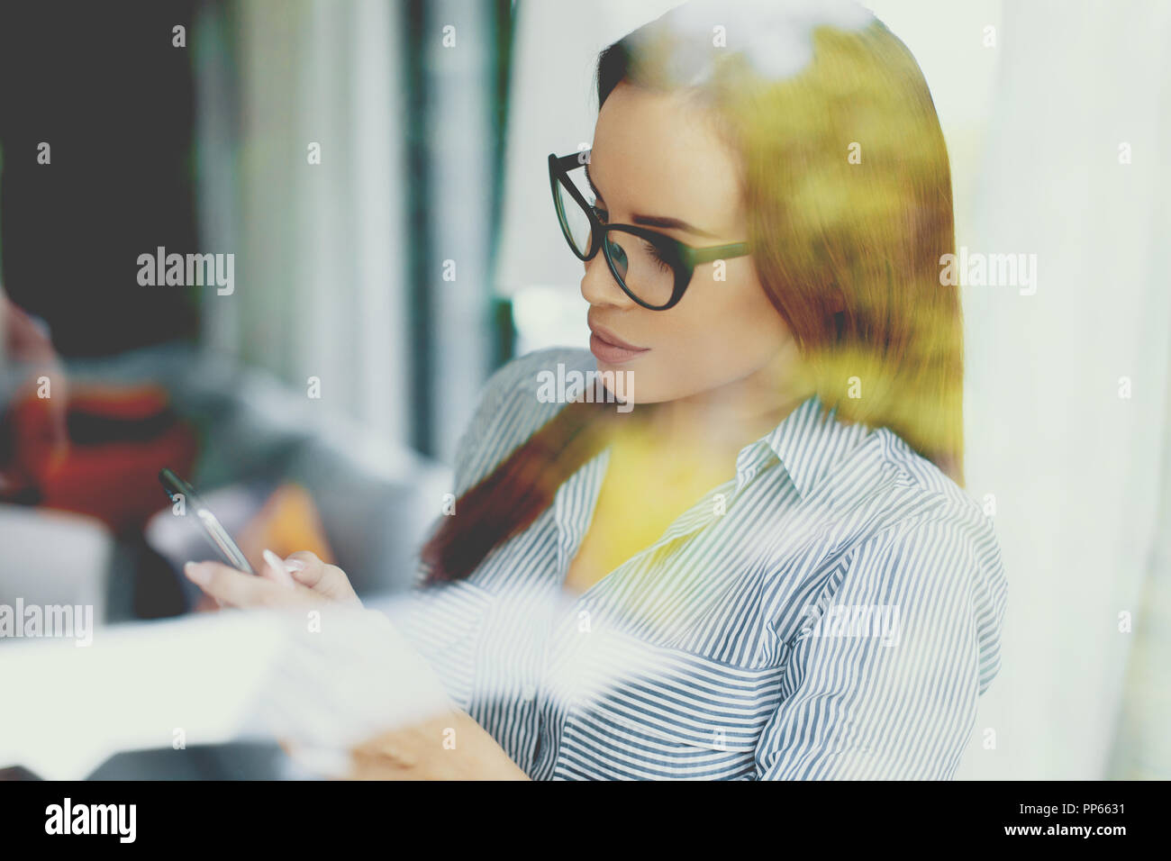 Woman behind glass hi-res stock photography and images - Alamy