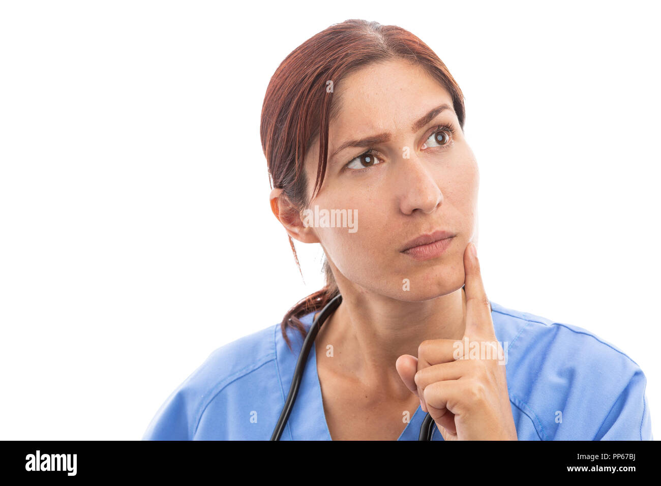 Wondering female nurse or doctor making thinking gesture and expression ...