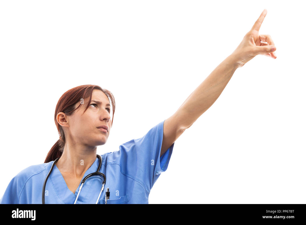 Female woman nurse or doctor pointing and looking up as showing medical ...