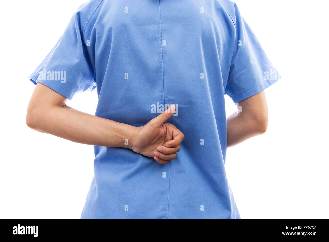 Rear view of female nurse or doctor back making thumbs up gesture from ...