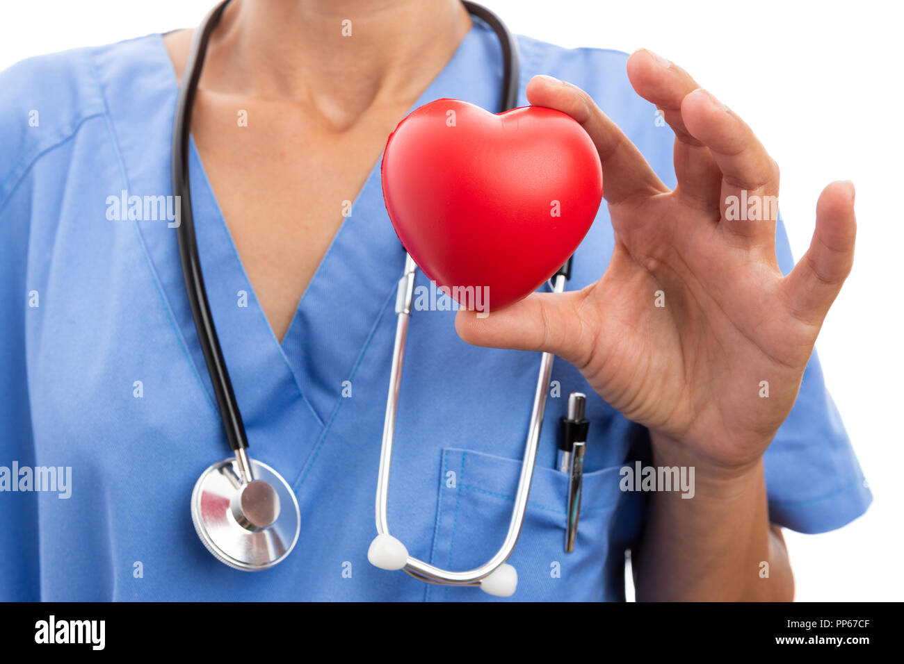 Closeup of female doctor cardiologist holding toy red heart as cardiac ...