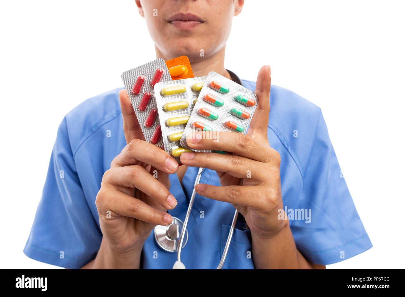 Closeup of female hospital nurse or doctor holding colorful pills ...